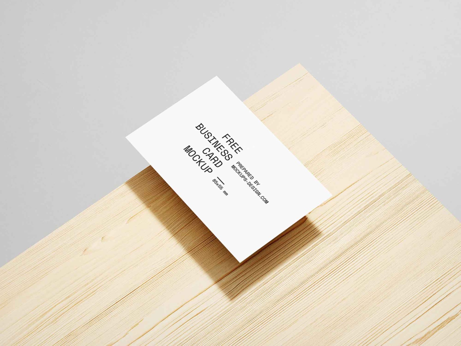 Free Business Card Above Wooden Slab PSD Mockups